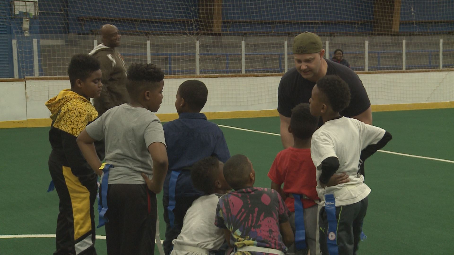 Police officers coaching young athletes | ksdk.com