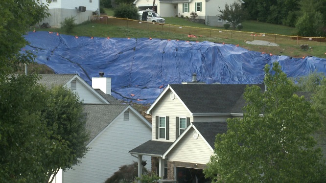 Flooding causes slope to slide into Fenton properties | ksdk.com