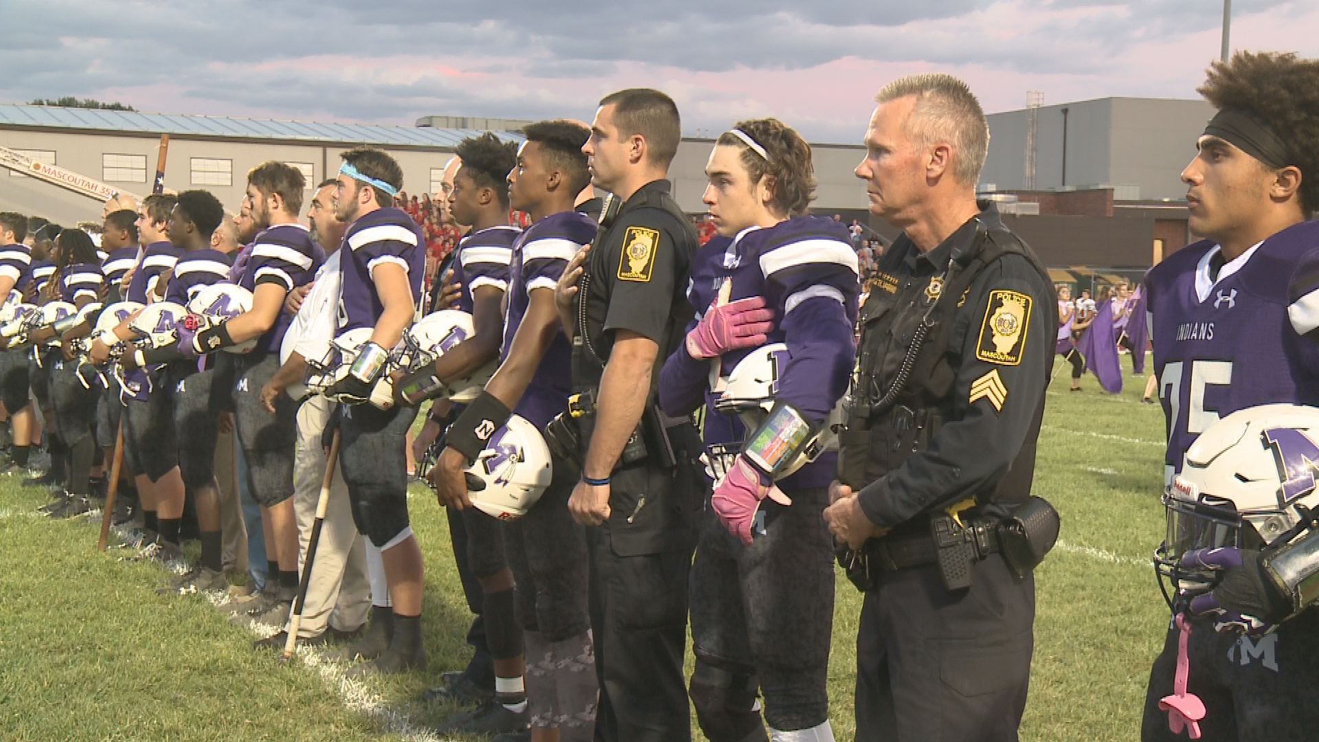 Mascoutah football team stands with police during national anthem ...